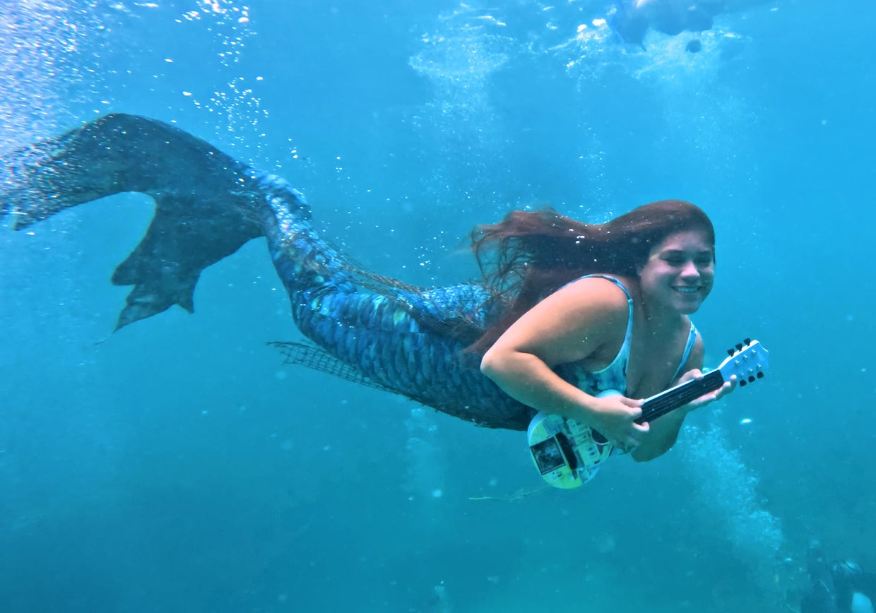 A concert played underwater? Watch mermaids, musicians and divers jam ...