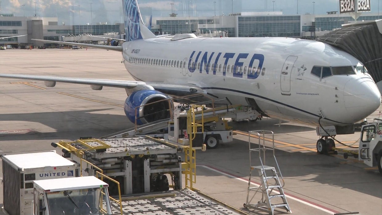 Staff in United's "nerve center" at Denver International Airport work ...