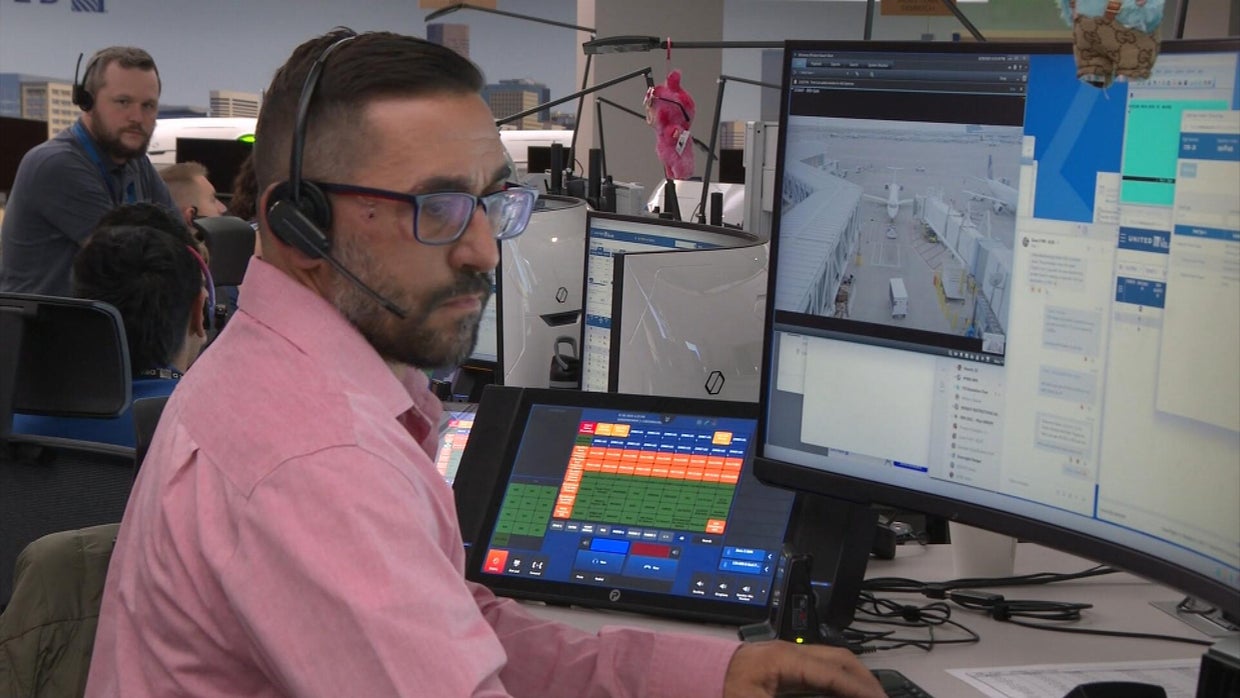 Staff in United's "nerve center" at Denver International Airport work ...