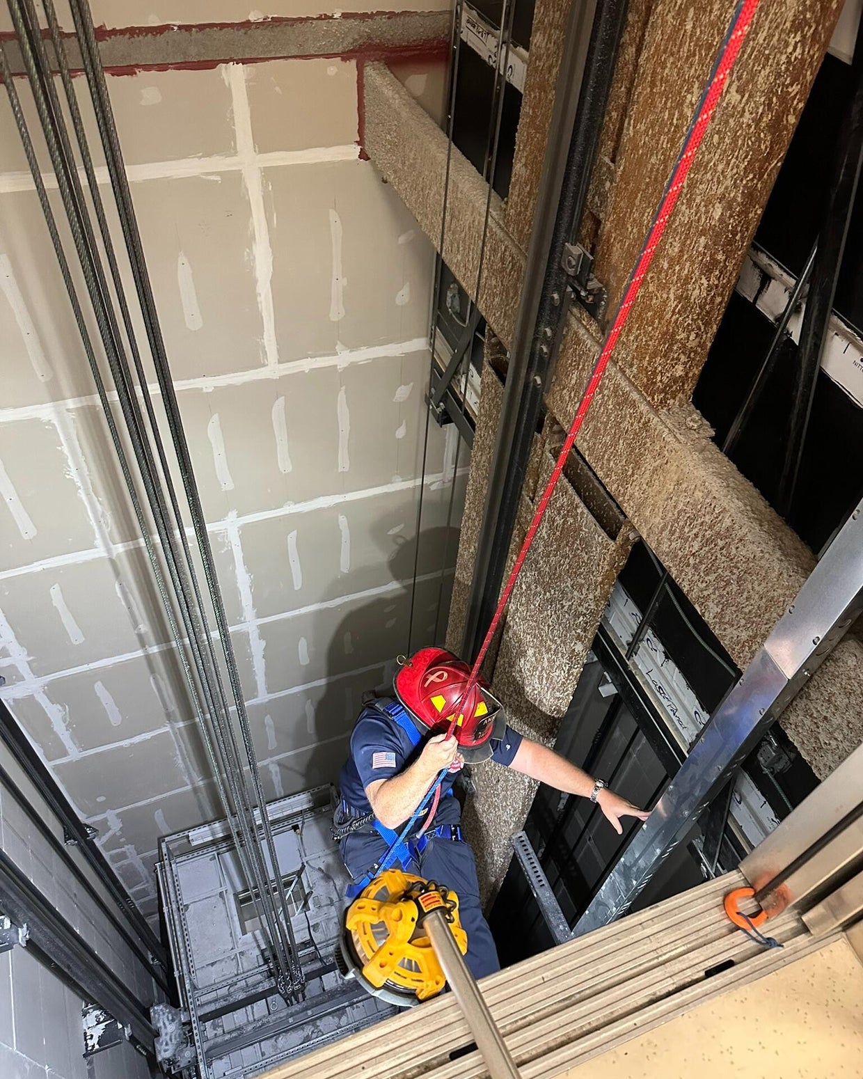 Employee stuck in elevator at Mott Children's Hospital rescued via rope ...
