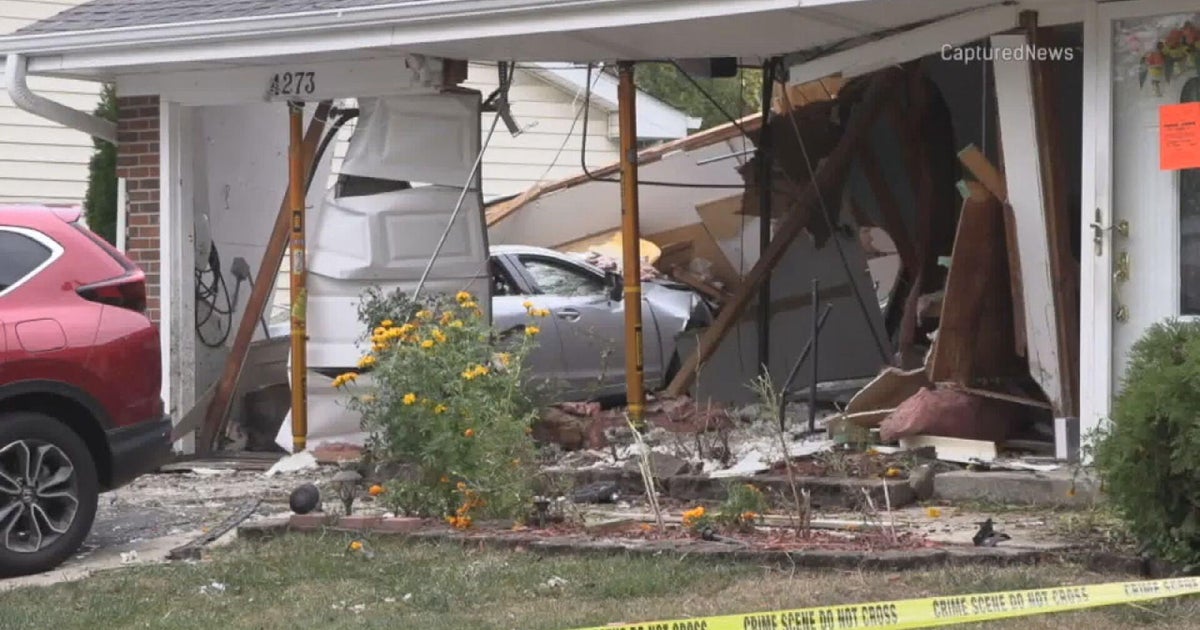 2 hurt when car crashes into Hanover Park home on Woodlake Drive - CBS ...
