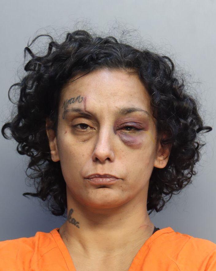 Miami woman charged with murder after man's naked body found under ...