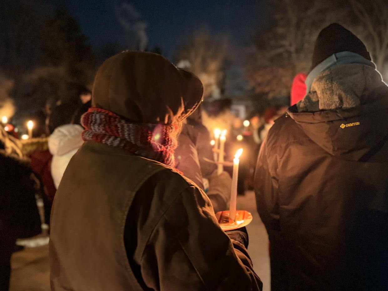 Quiet candlelight vigils light street corners across Twin Cities area ...