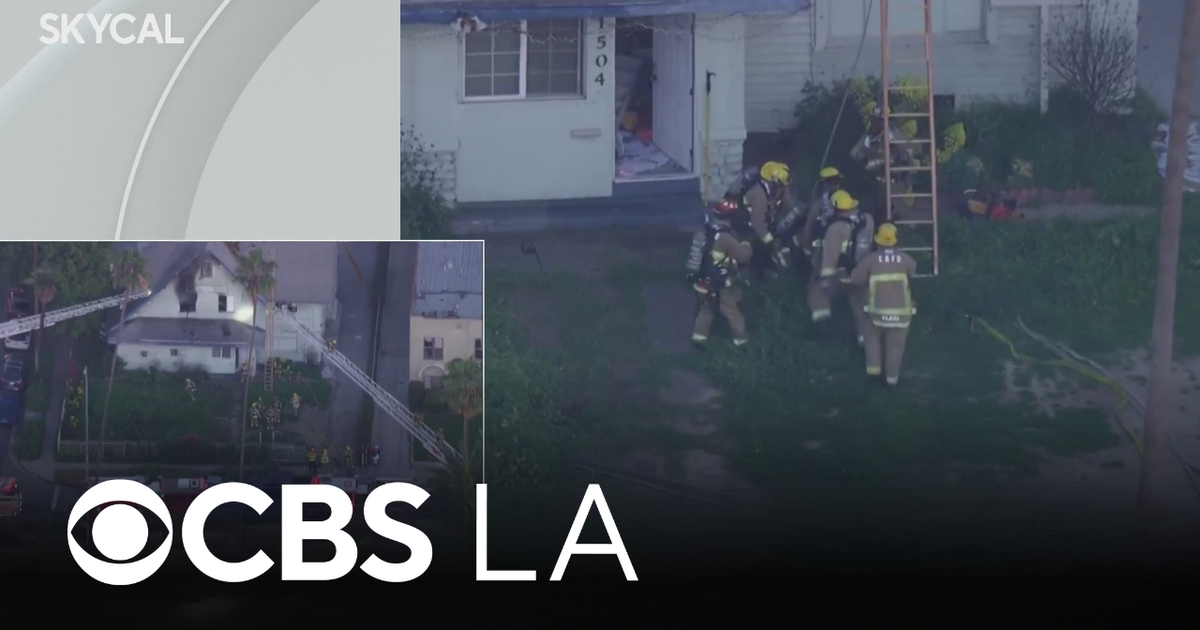 Los Angeles firefighter falls off ladder while battling house fire in ...