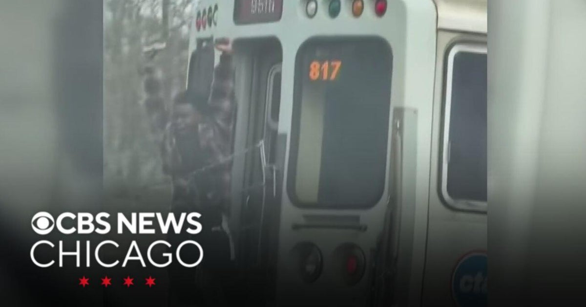 Risky Red Line rider dangles from train only held up by chains in viral ...