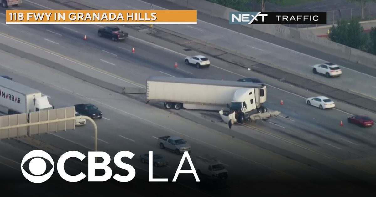 Semi truck crashes through center divider of 118 and 405 freeway ...